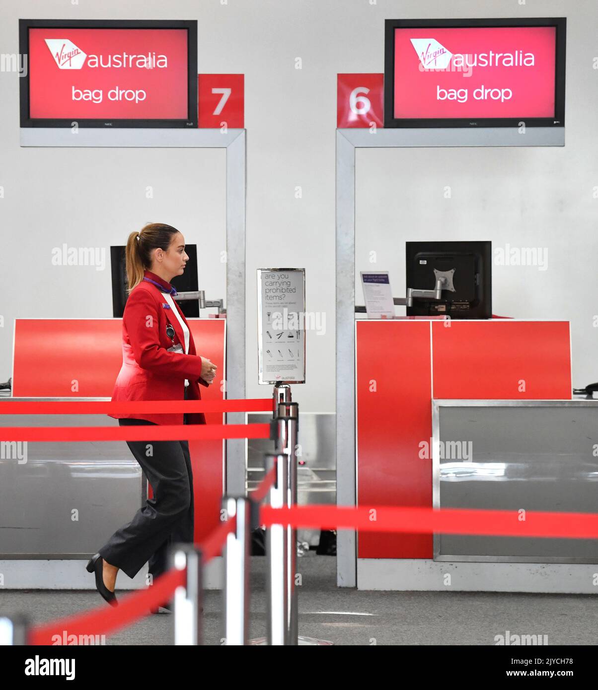 A Virgin Australia staff member is seen at the Virgin Australia ...