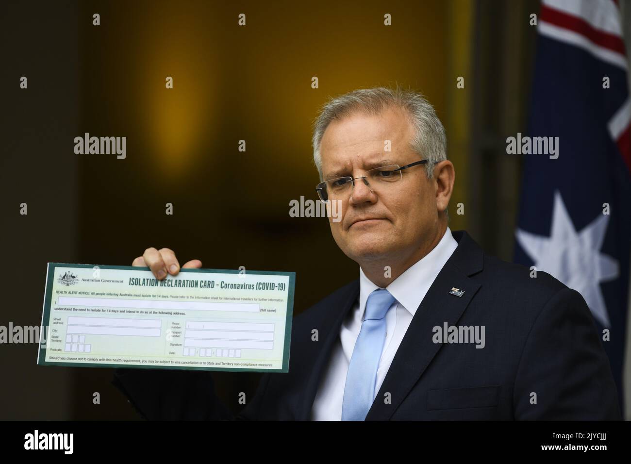 Australian Prime Minister Scott Morrison holds up a Coronavirus ...