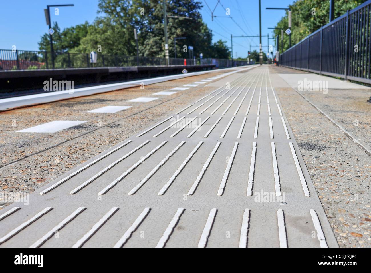 Guiding lines on the ground for blind people on station Nieuwerkerk aan ...
