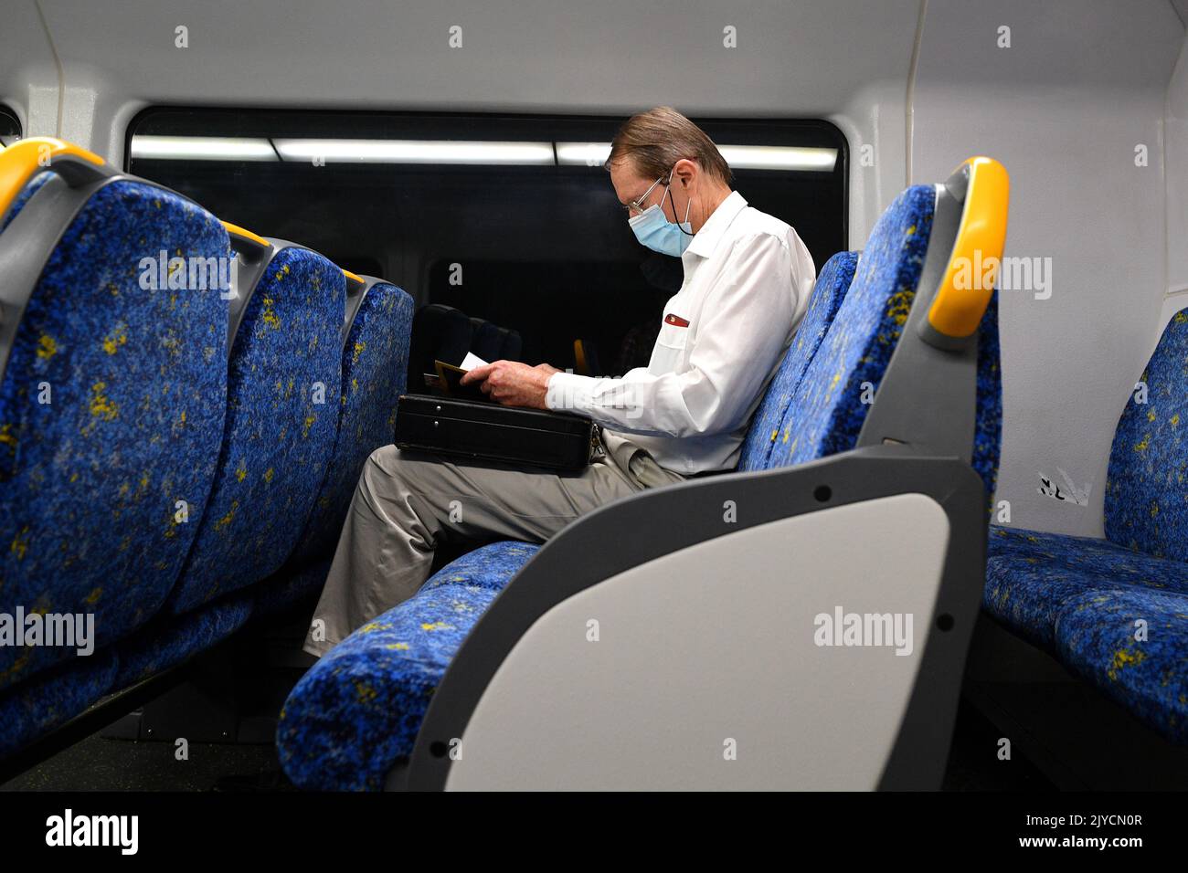 A commuter is seen on train in Sydney, Wednesday, April 1, 2020. (AAP ...