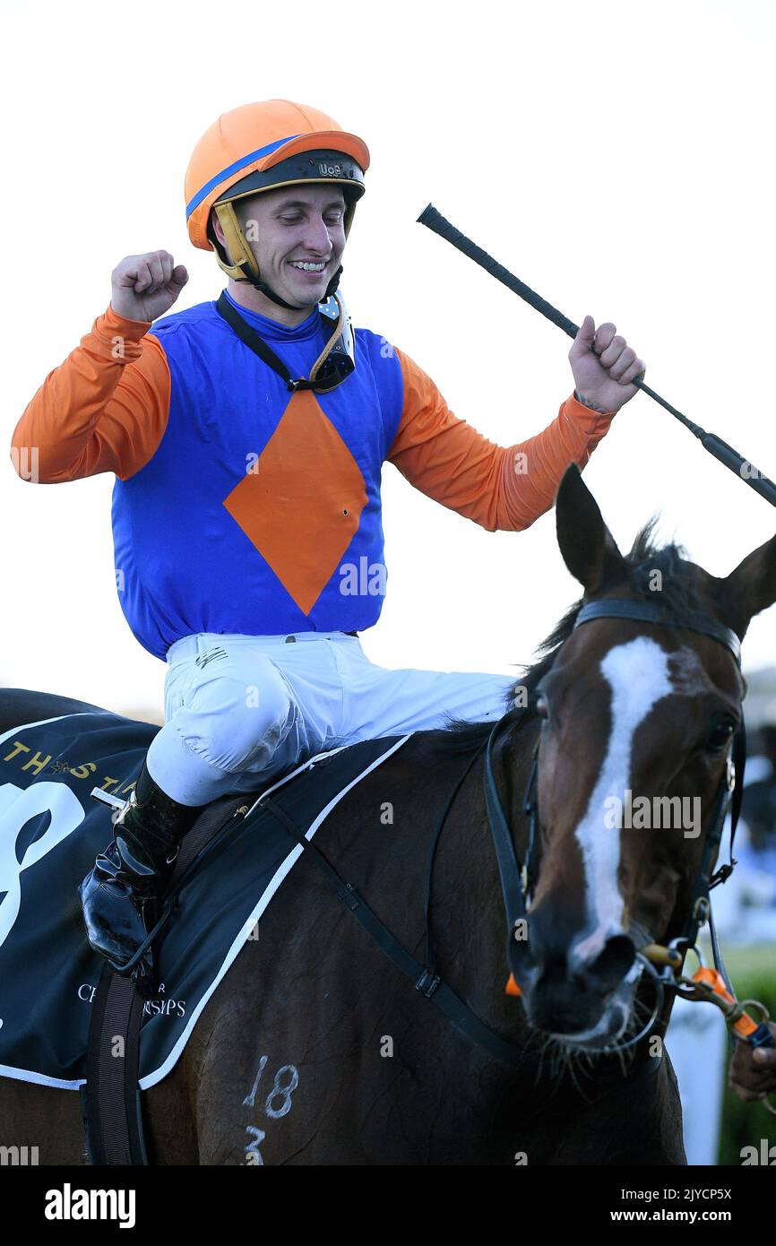 Jockey James Innes Jnr gestures as he returns to the mounting yard ...