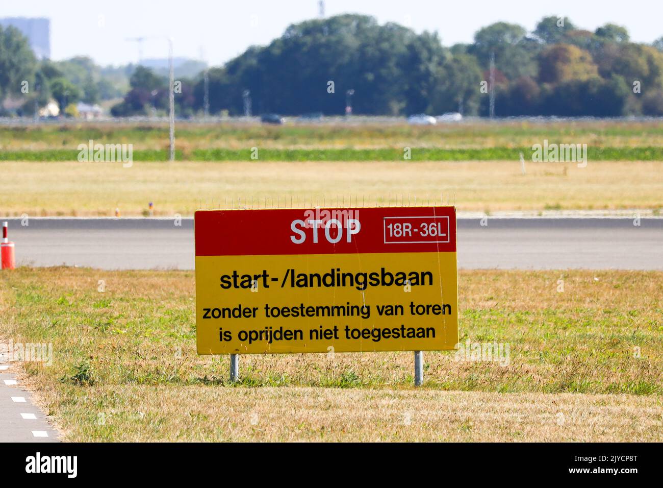 Sign at Schiphol Amsterdam Airport with Stop - Start and landin strip ...