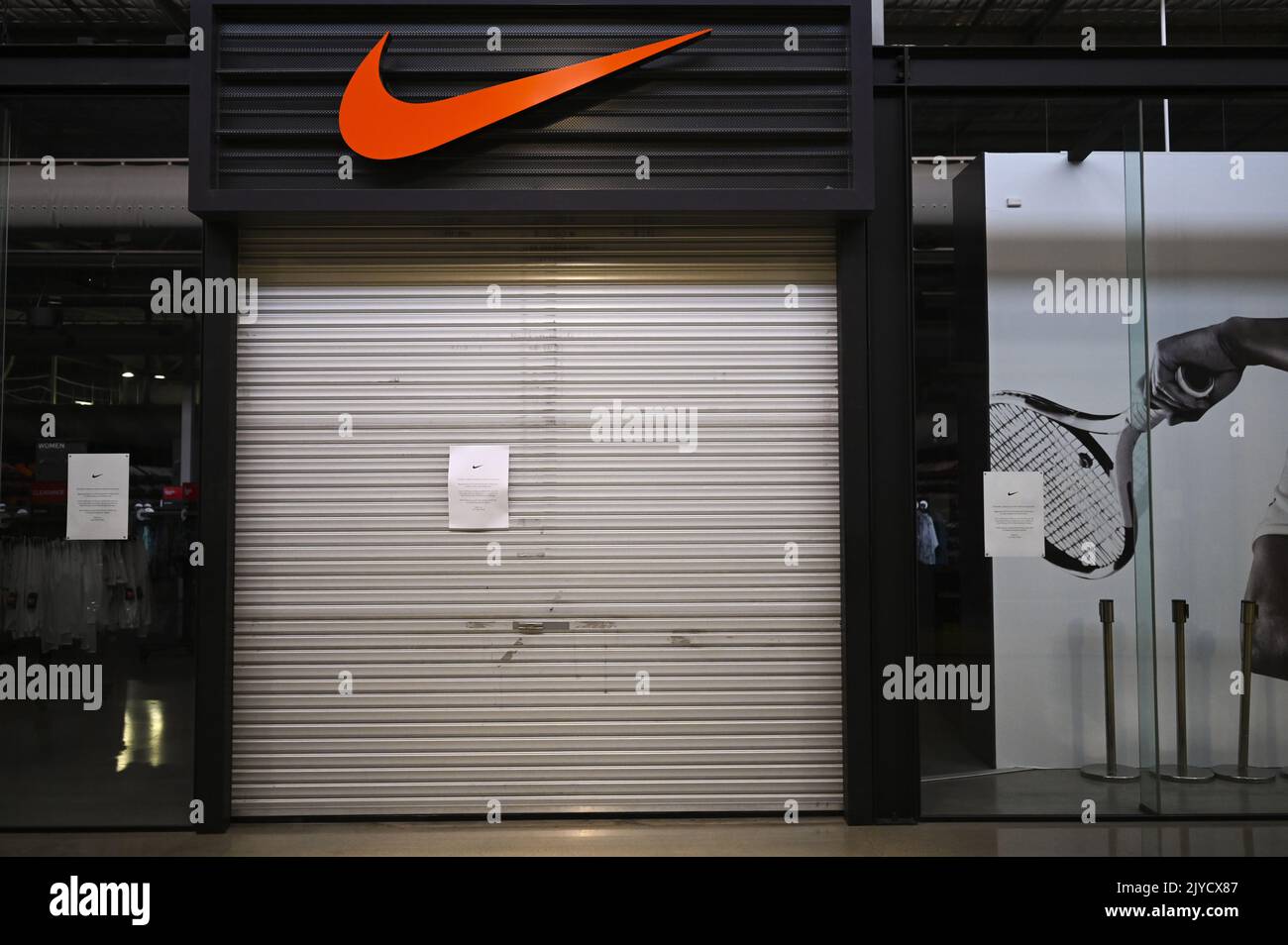 A closed shop front is seen inside an Outlet Shopping Centre in ...