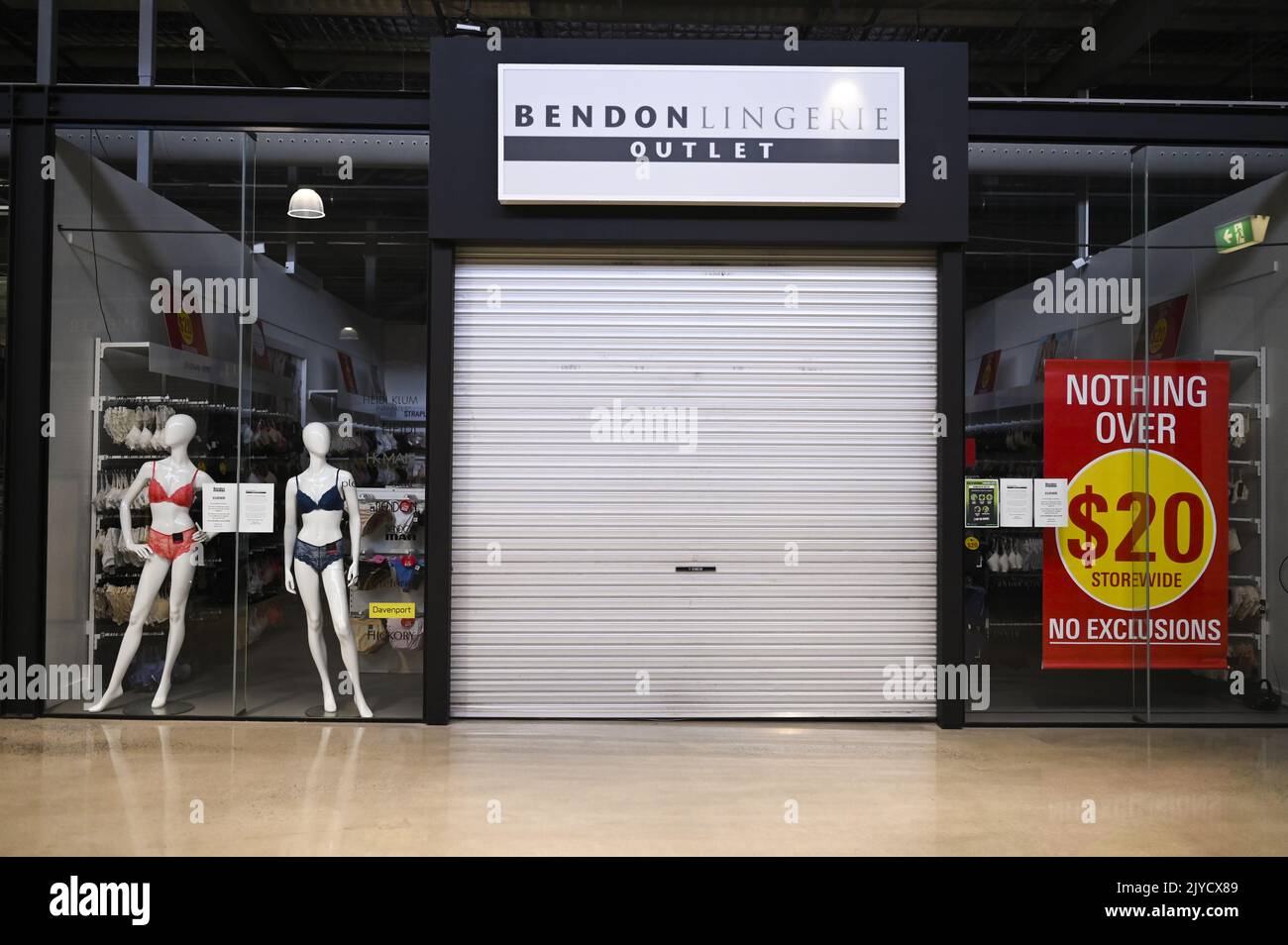 A closed shop front is seen inside an Outlet Shopping Centre in ...