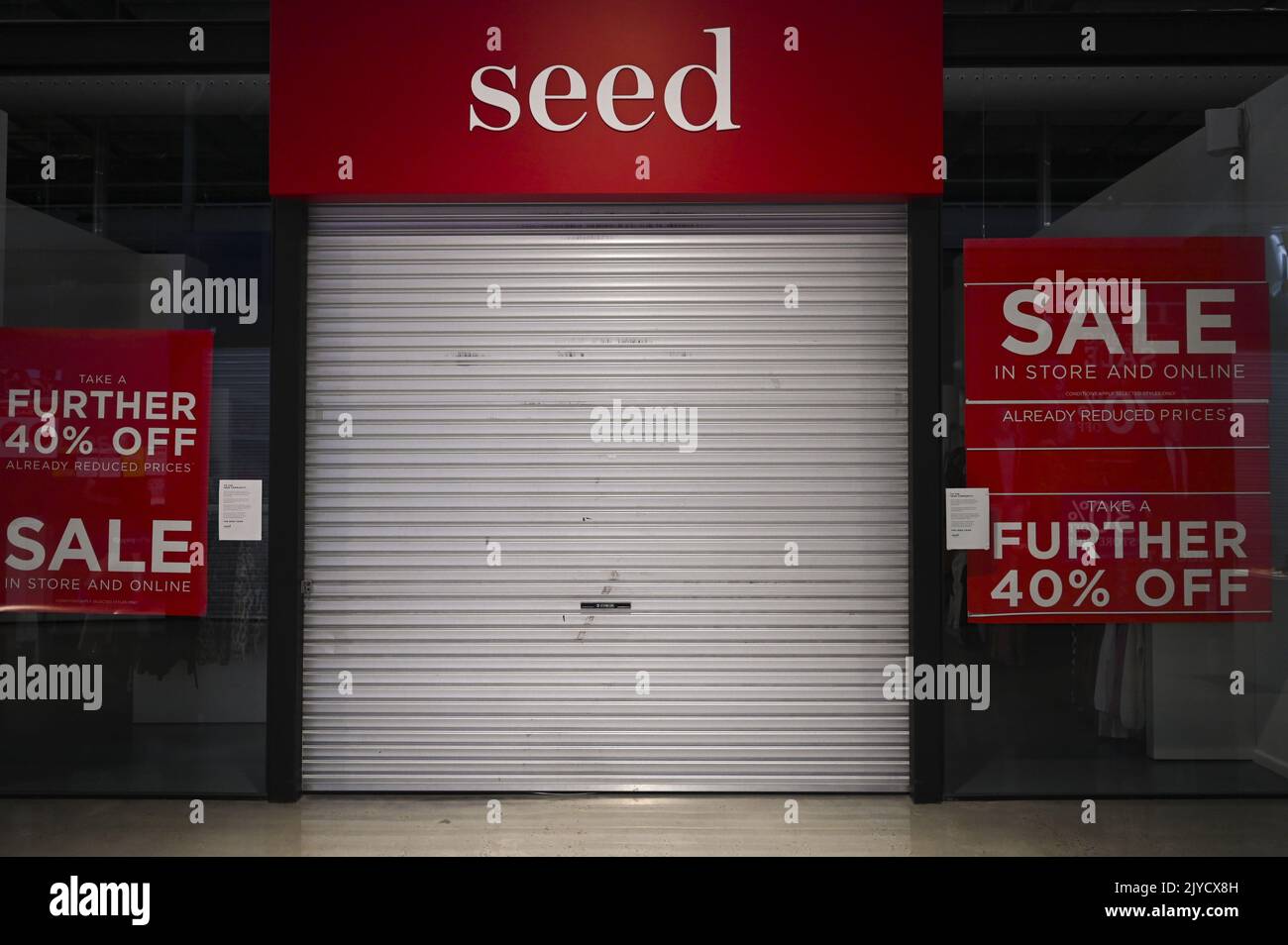 A closed shop front is seen inside an Outlet Shopping Centre in ...