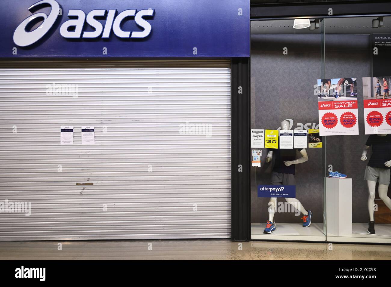 A closed shop front is seen inside an Outlet Shopping Centre in ...