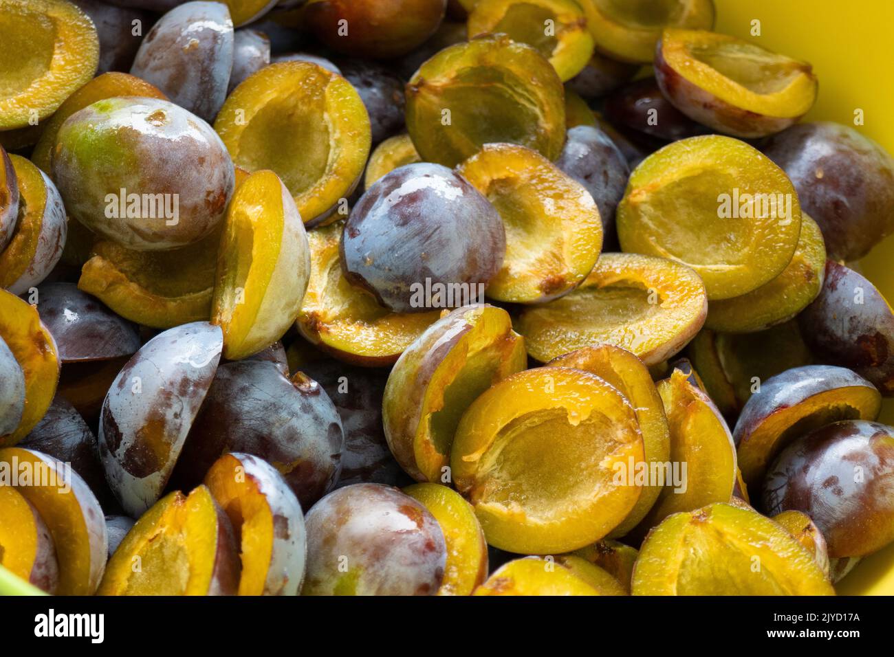 Plums harvest.Plum halves background. Juicy pulp texture.Farm organic ...