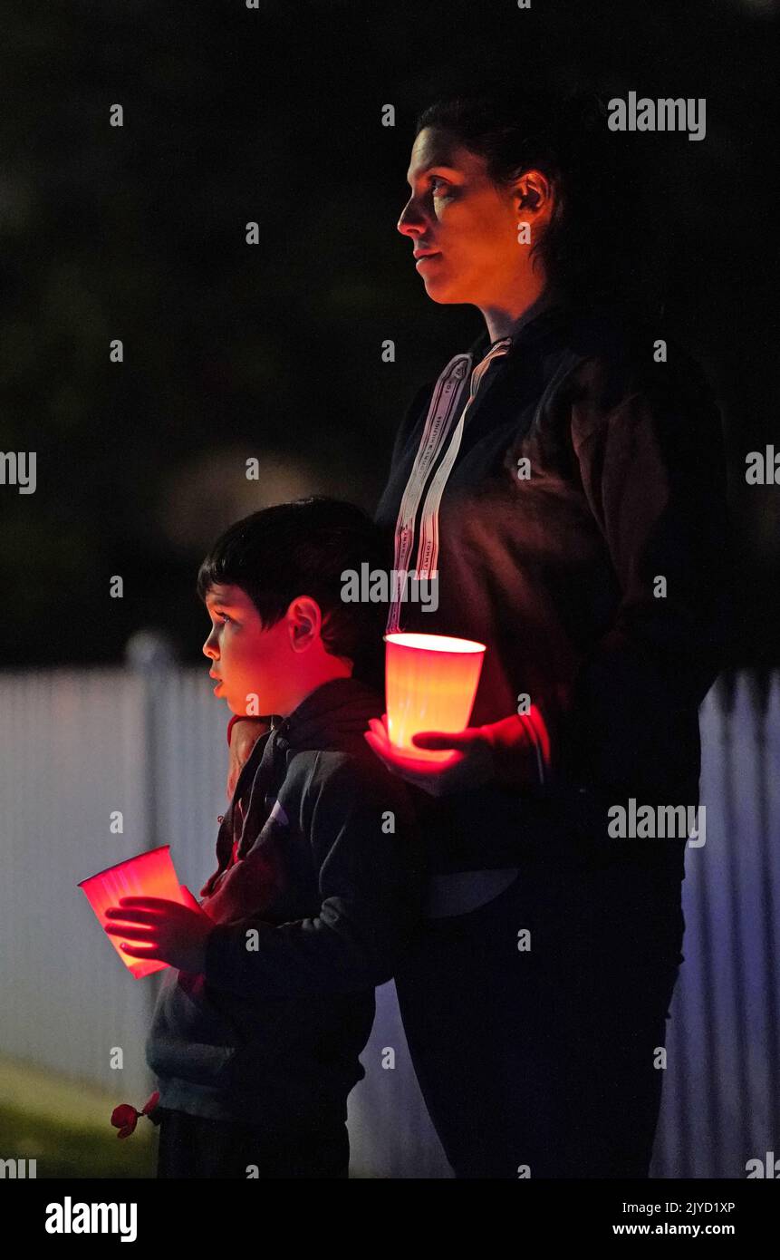 Residents in Clara Street, Macleod stand in their driveways at dawn on ...