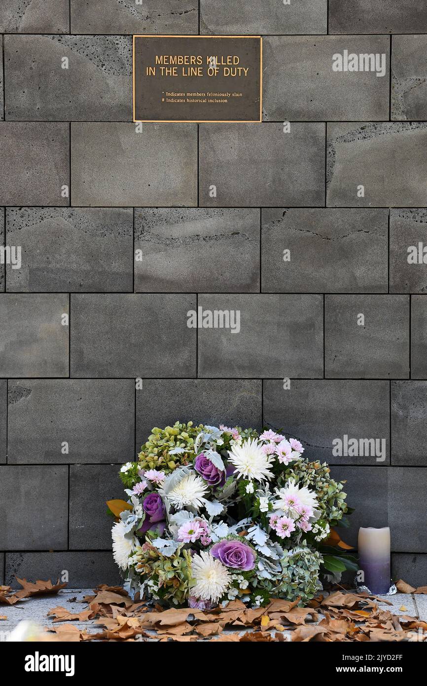 Flowers are seen at the Victoria Police Memorial in Melbourne, Monday ...