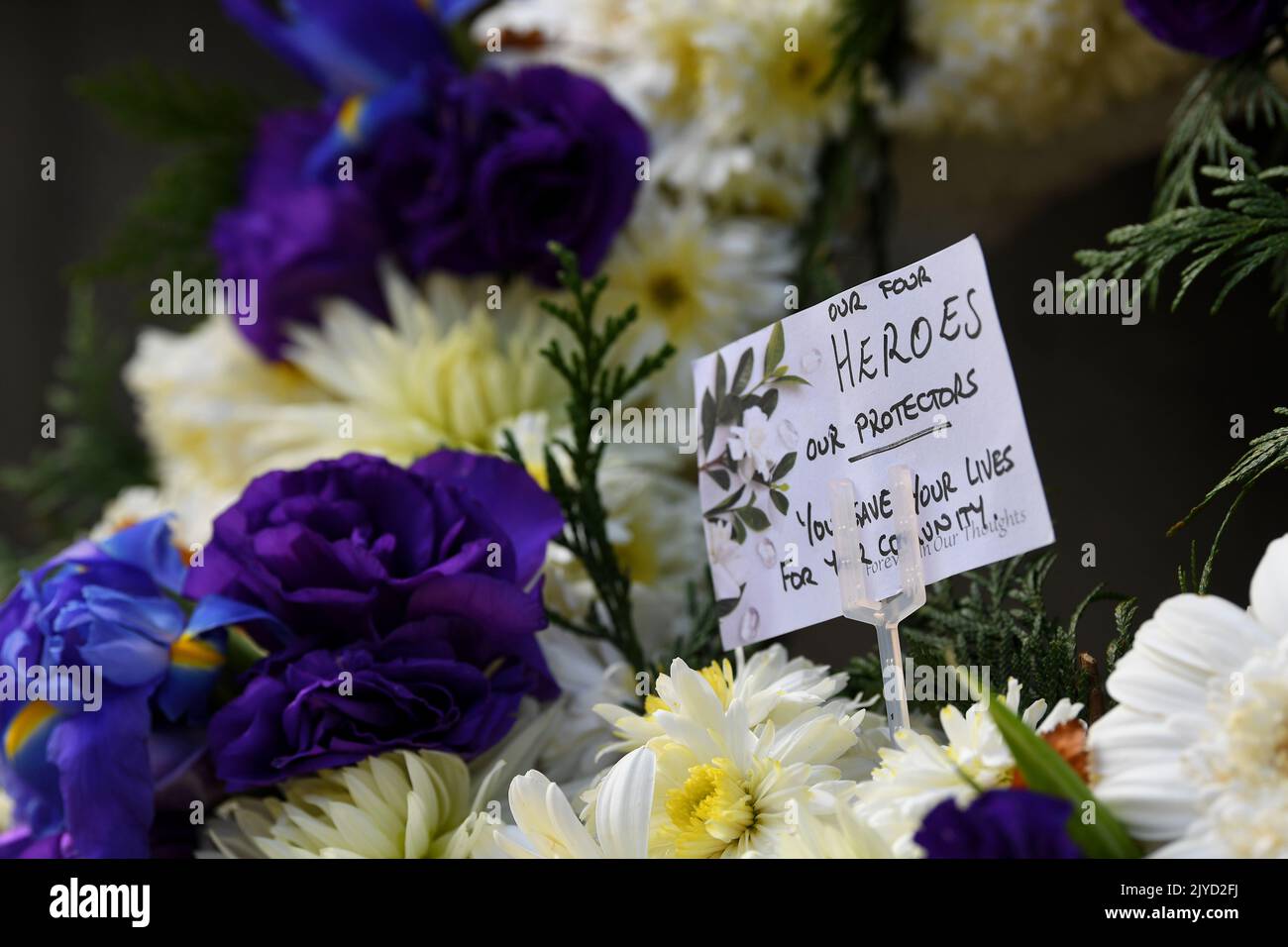 Flowers are seen at the Victoria Police Memorial in Melbourne, Monday ...