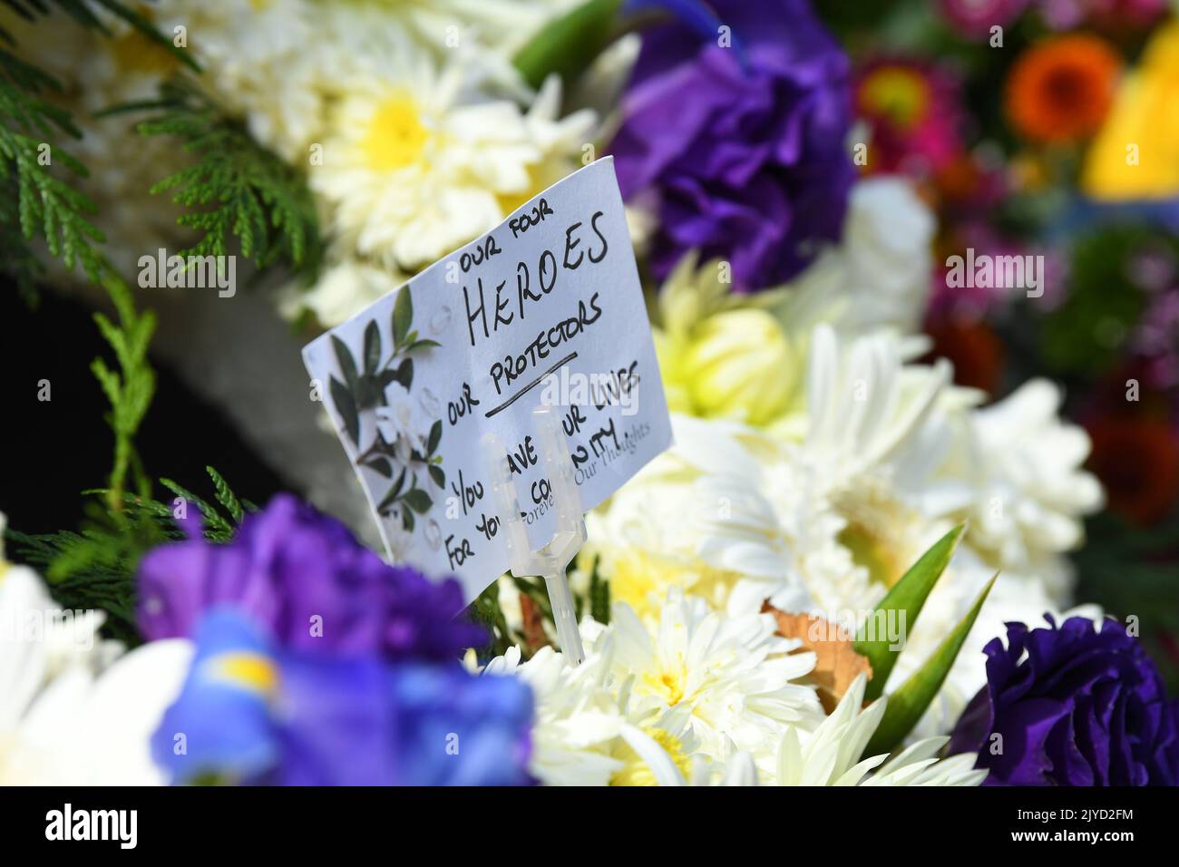 Flowers are seen at the Victoria Police Memorial in Melbourne, Monday ...