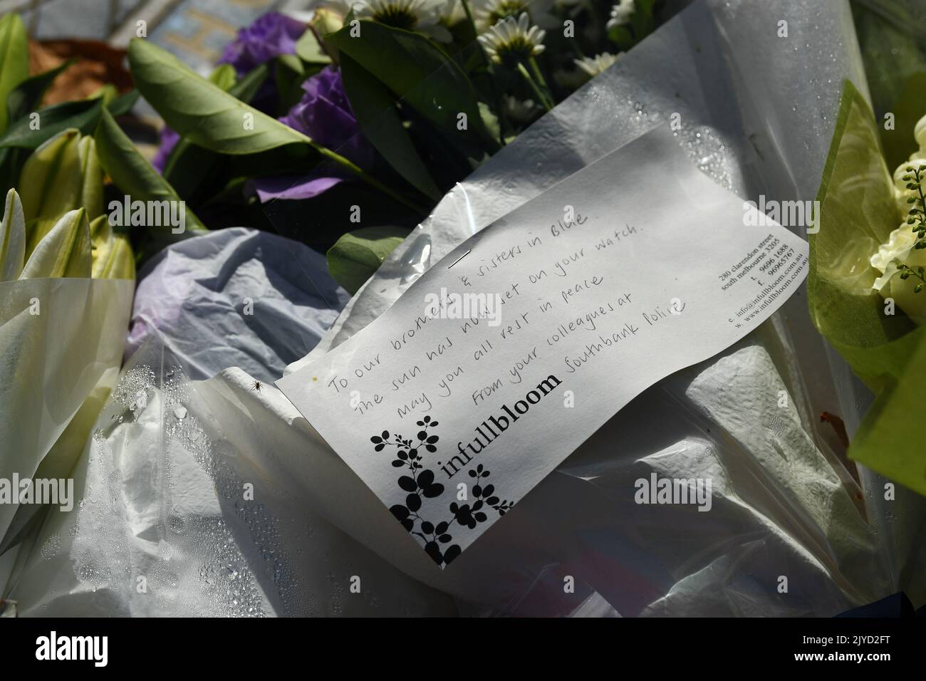 Flowers are seen at the Victoria Police Memorial in Melbourne, Monday ...