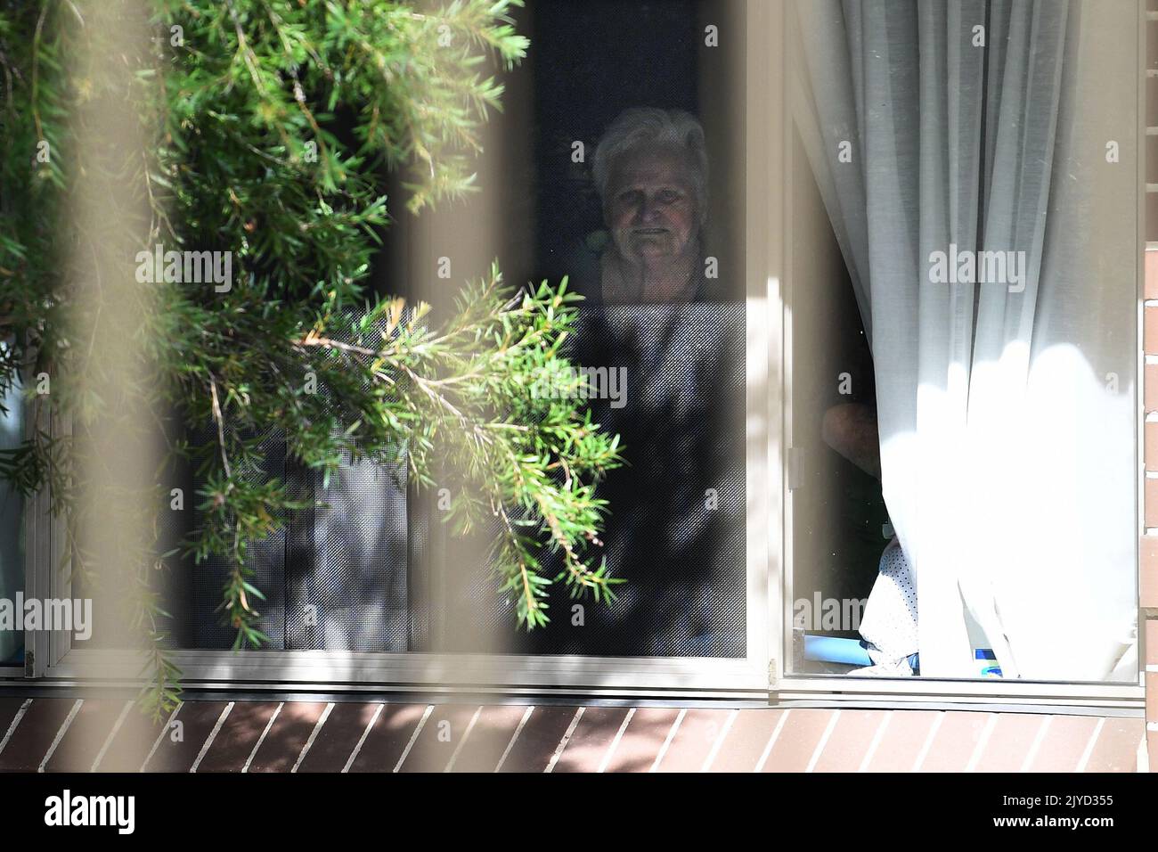 Patricia Shea, 76, looks out from her bedroom window to the perimeter ...