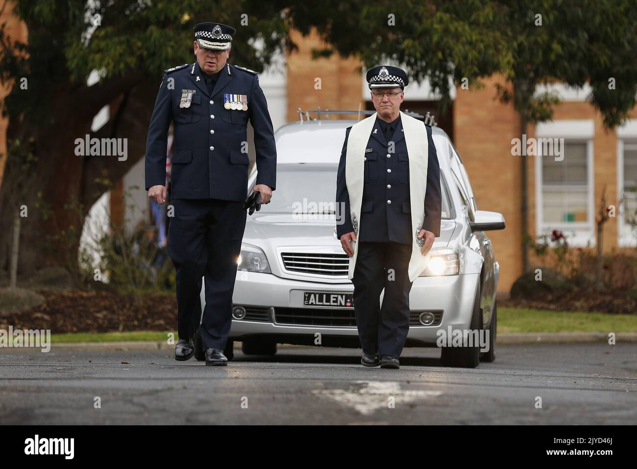 Victoria Police Chief Commissioner Graham Ashton (left) and Police Chaplain Andrew Mellor lead ...