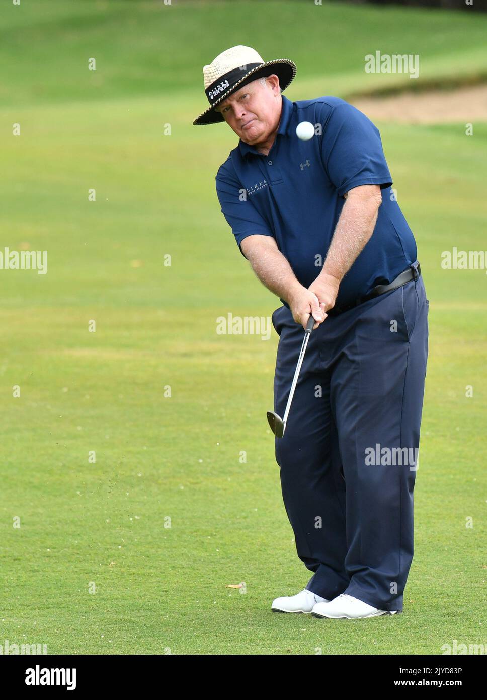 Australian professional golfer Peter Senior is seen chipping onto the ...