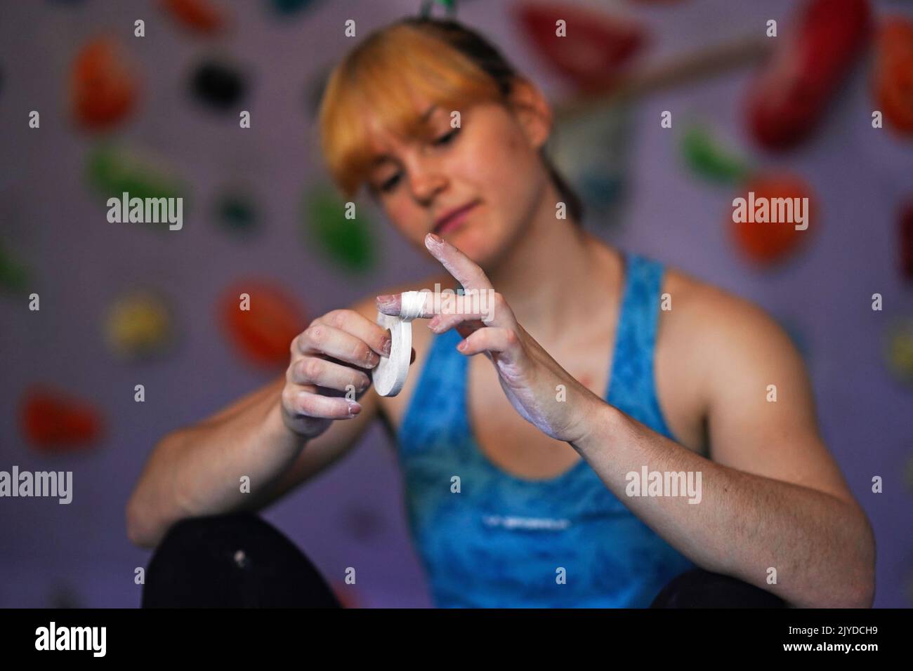 Australian climber Oceana Mackenzie tapes her hands as she trains at ...