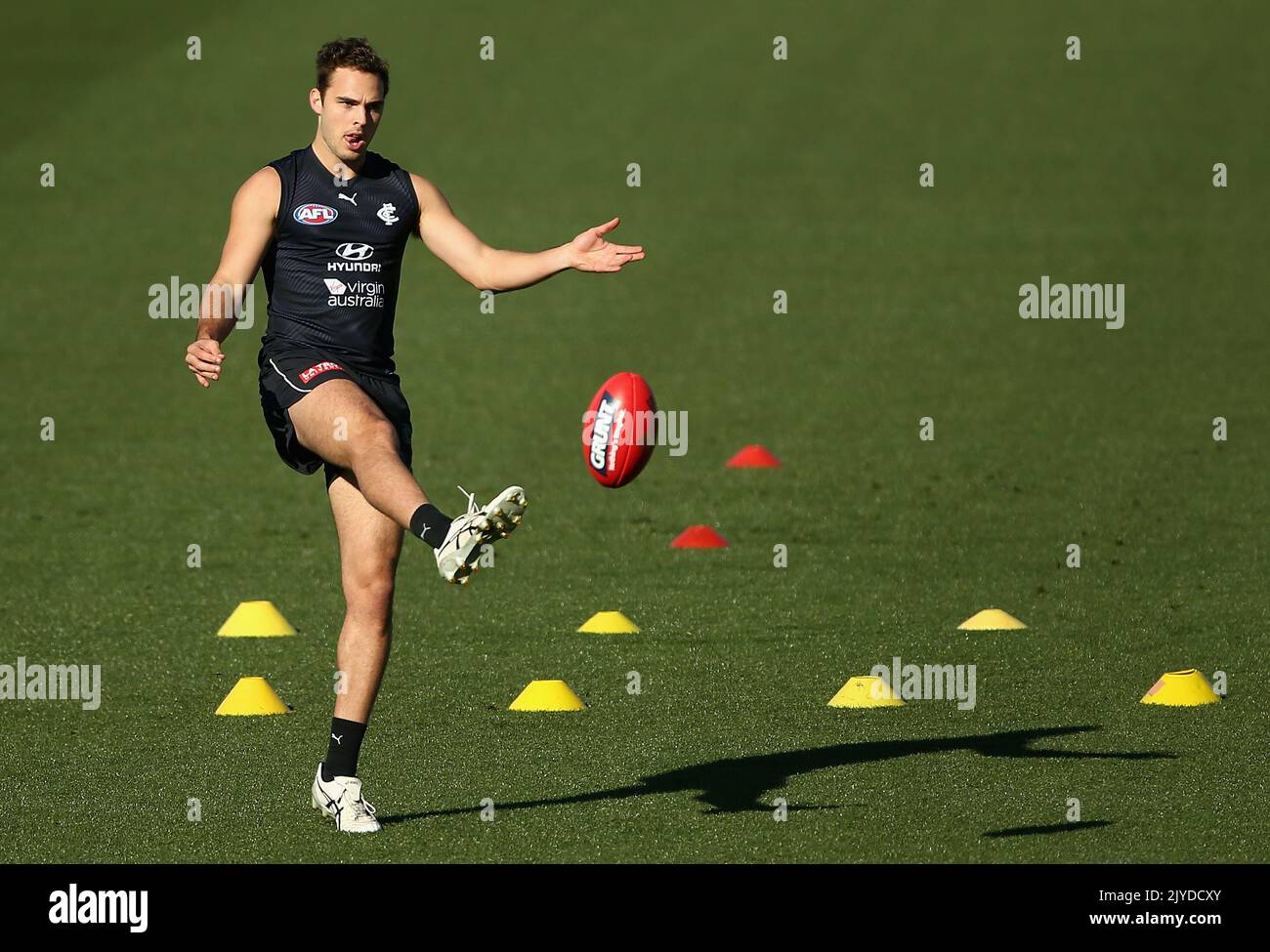 David Cuningham kicks during a Carlton Blues training session at Ikon ...