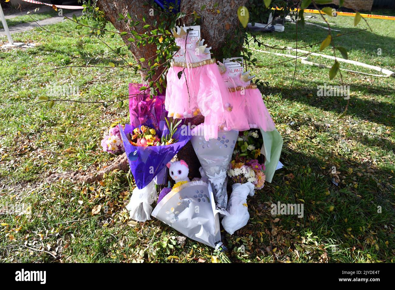 A makeshift memorial at the scene of a house fire, where three year old twins died in the town ...