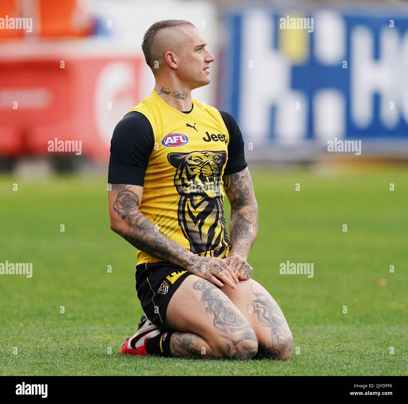 Dustin Martin of the Tigers stretches during a Richmond Tigers AFL ...