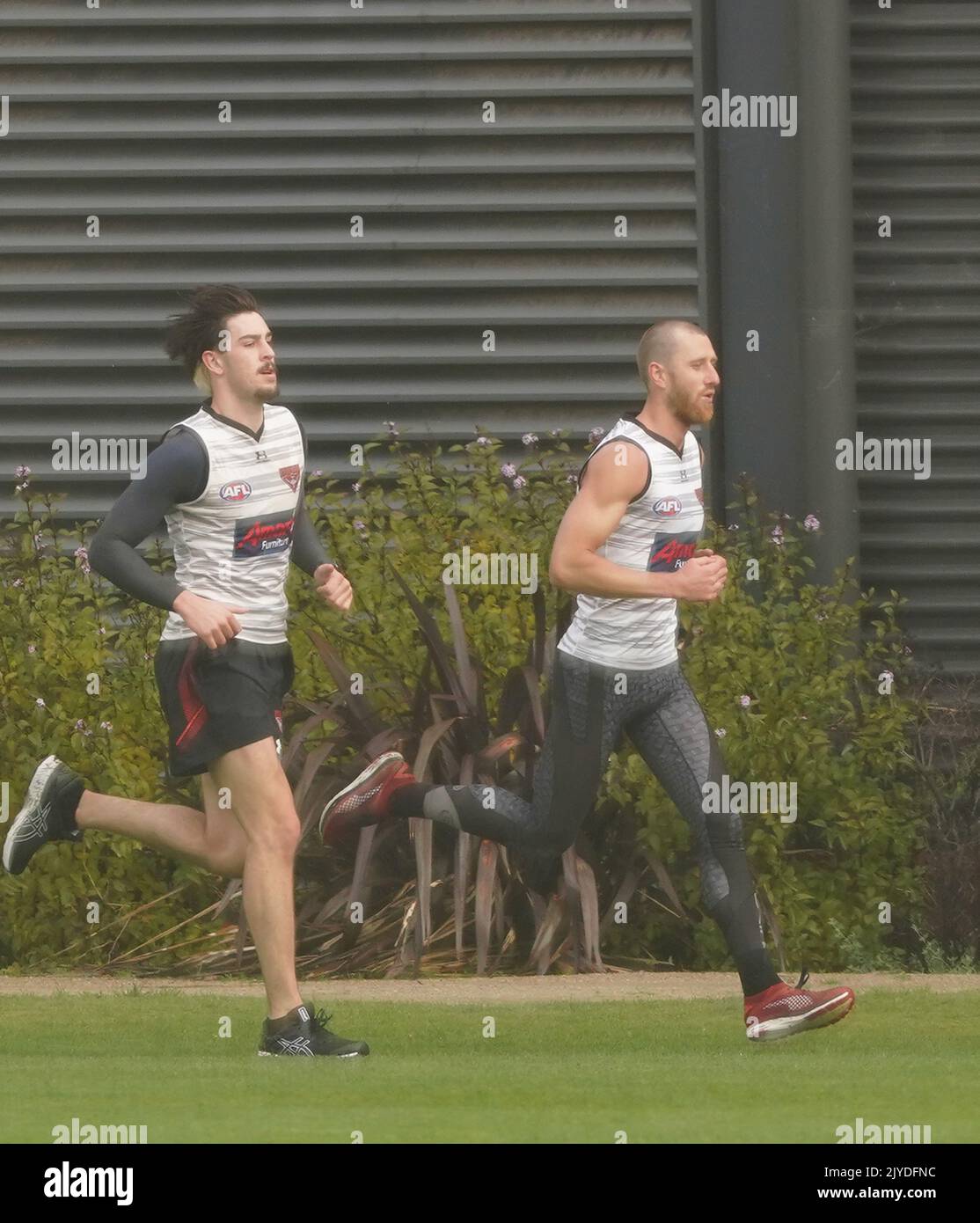 Noah Gown and Dyson Heppell run during an Essendon Bombers AFL training ...