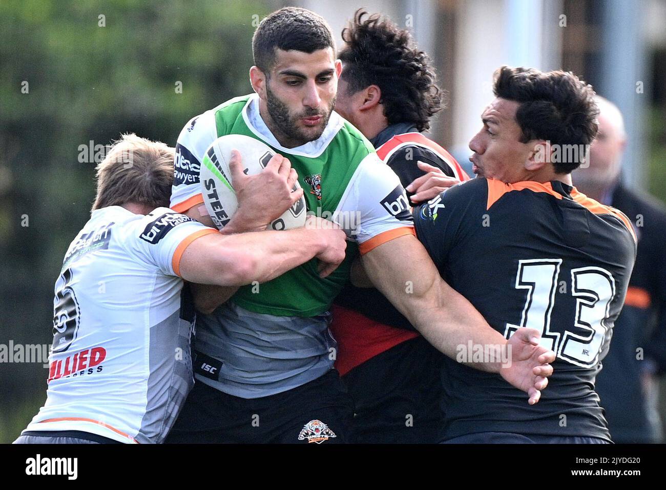 Alex Twal (centre) of the Wests Tigers takes part in a training session ...