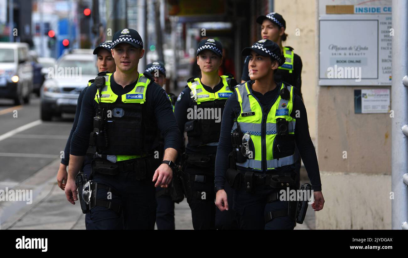 Victoria Police officers patrol along Victoria Street in Richmond ...