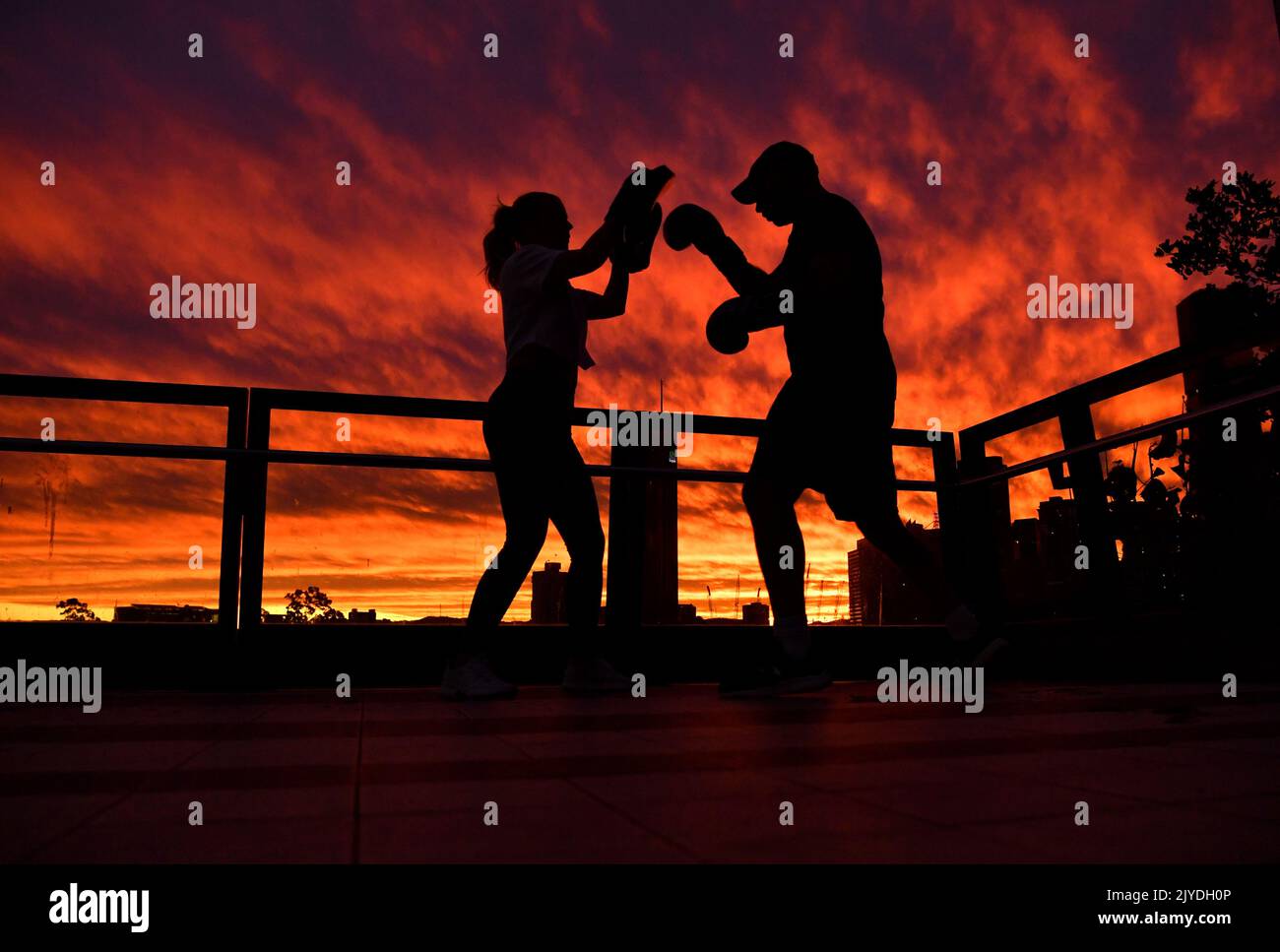 Tamika Eastley (left) and Anthony Ragusa (right) are seen working out ...