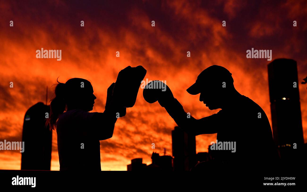 Tamika Eastley (left) and Anthony Ragusa (right) are seen working out ...