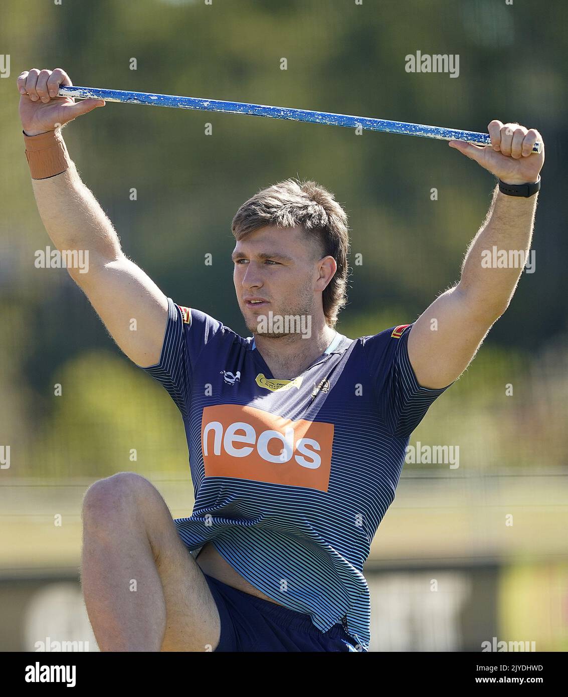 Jai Arrow is seen with a ball stuffed up his shirt during an NRL Titans ...