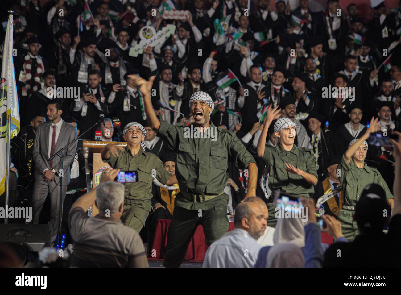 Palestinian students attend their graduation ceremony at Al-Quds Open ...