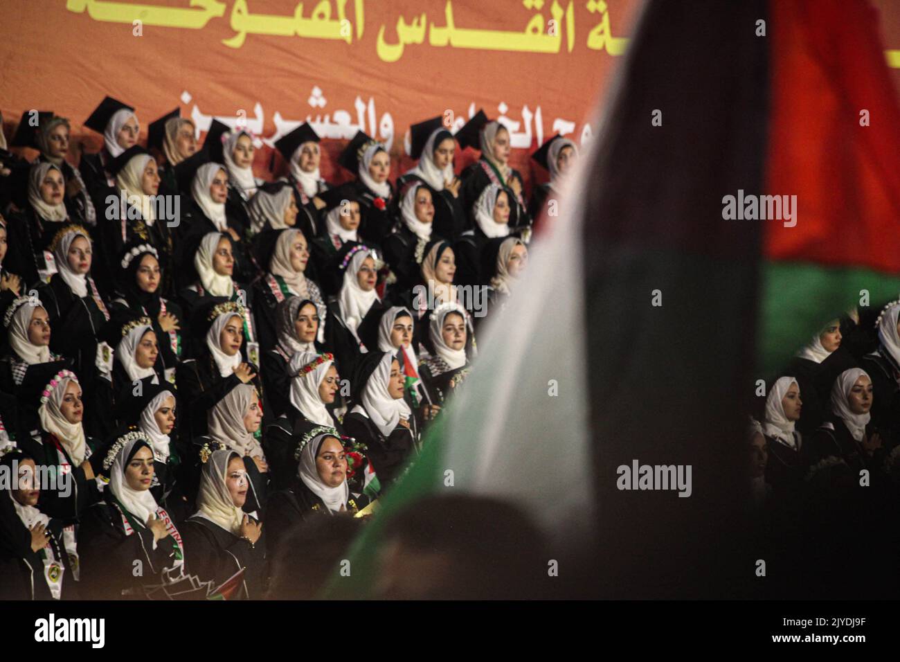 Palestinian students attend their graduation ceremony at Al-Quds Open ...