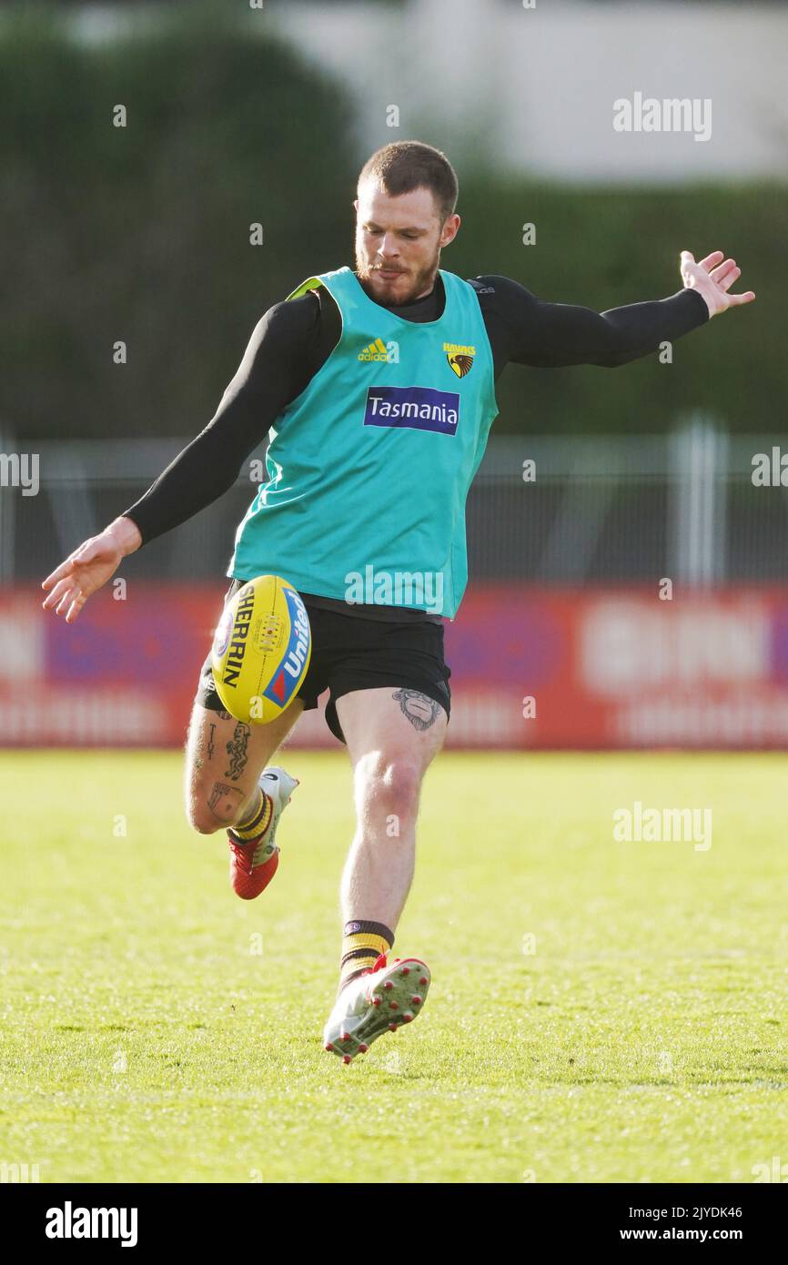 Blake Hardwick of the Hawks kicks the ball during an AFL Hawks training ...