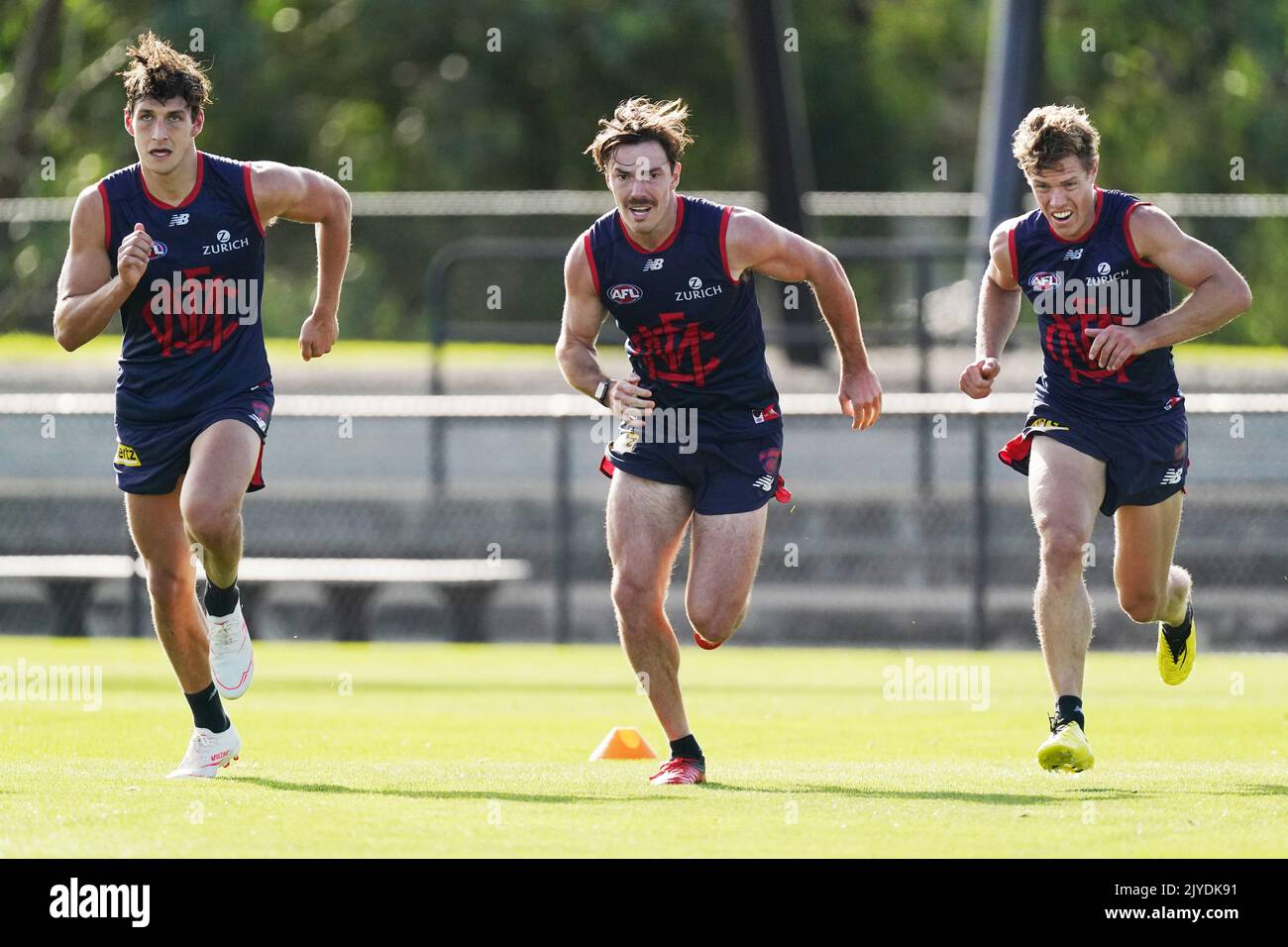 Sam Weideman, Michael Hibberd and Jake Melksham of the Demons run ...