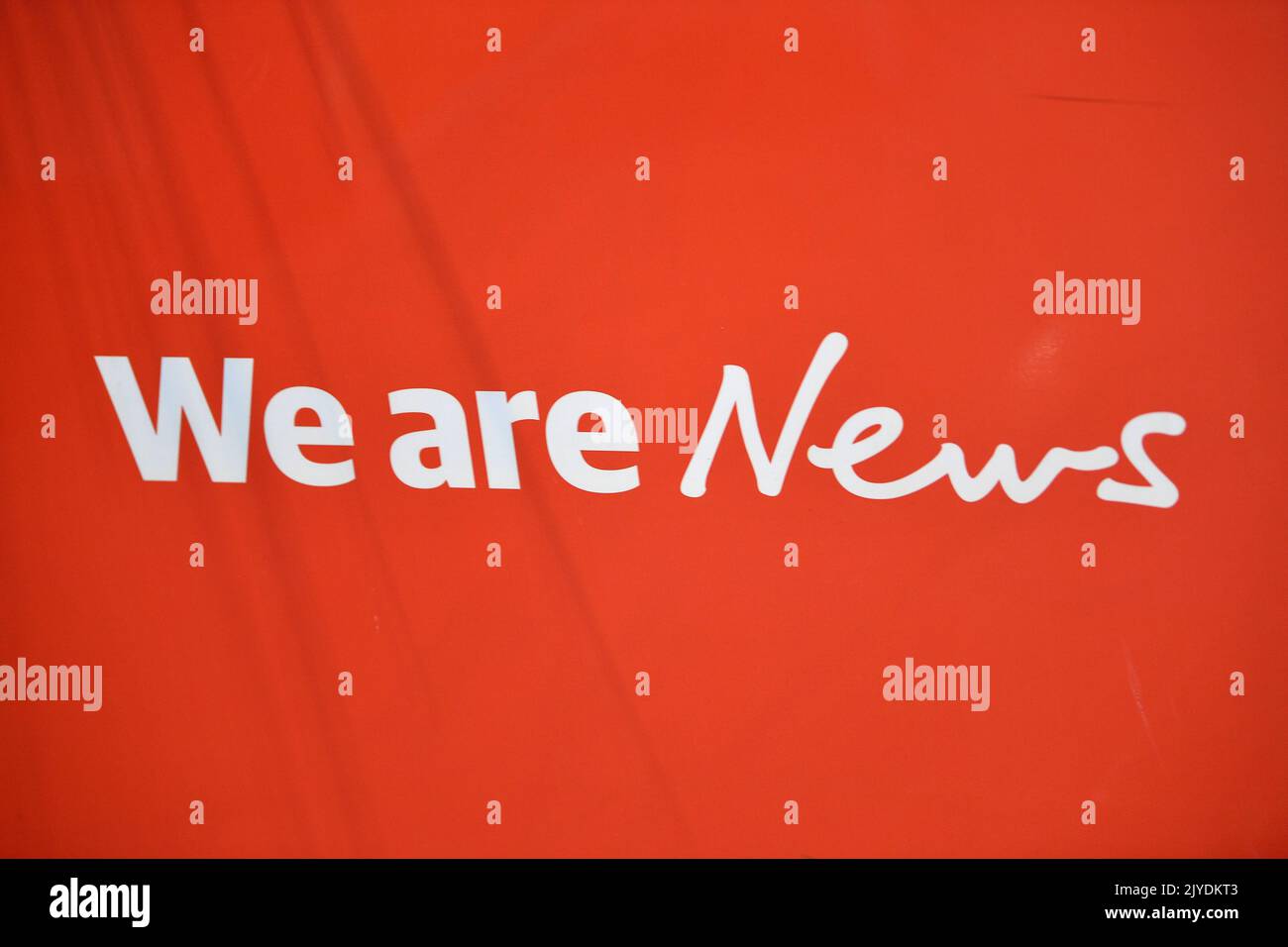 Advertising posters and News slogans are seen in the window of News ...