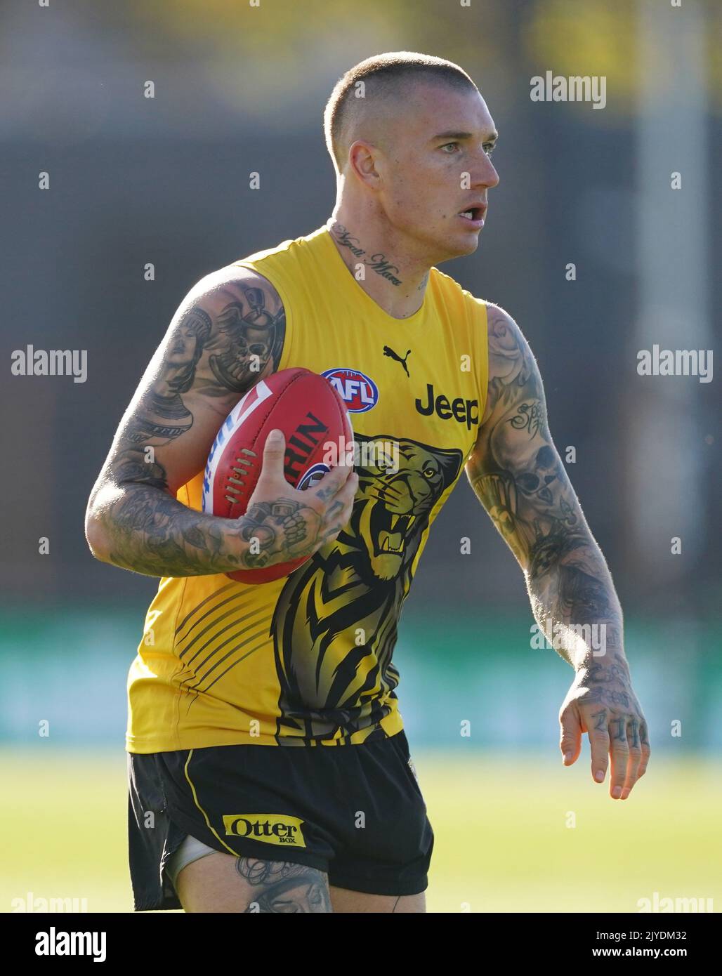 Dustin Martin runs with the ball during an AFL Richmond Tigers training ...