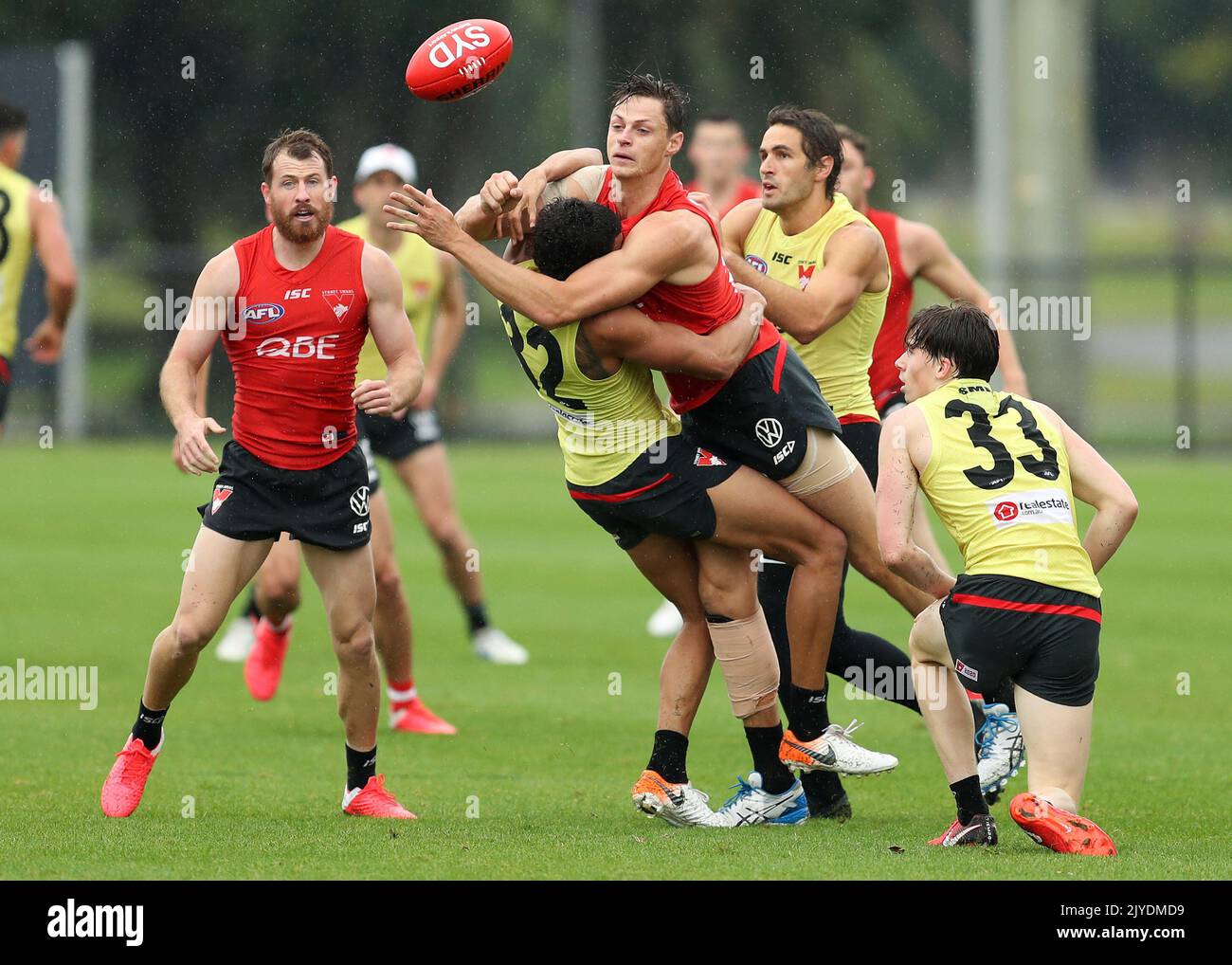 Callum Sinclair of the Swans is tackled by team mate James Bell during ...