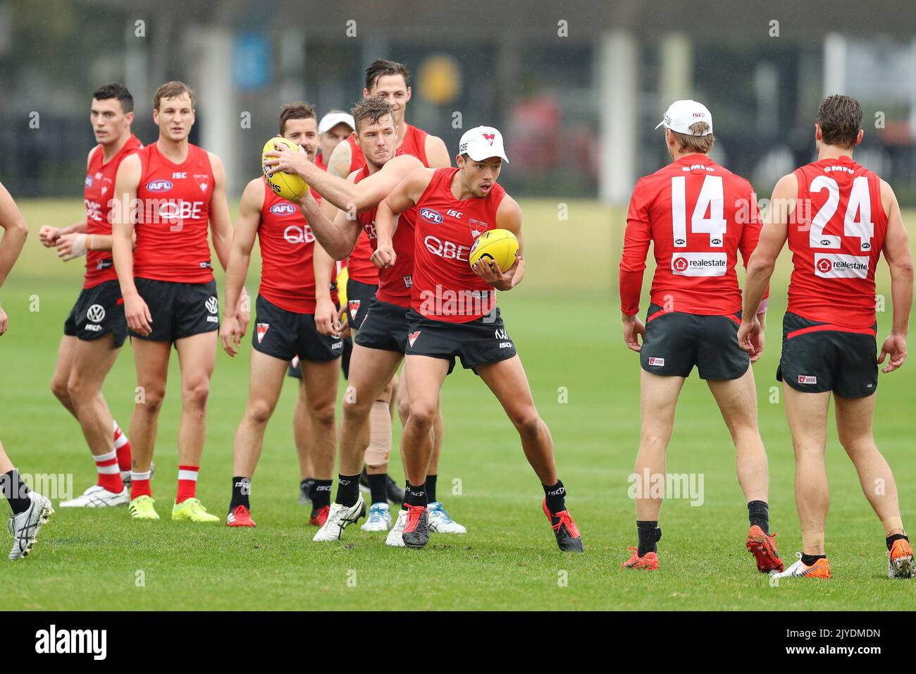 Luke Parker and Oliver Florent of the Swans run a drill during a Sydney ...