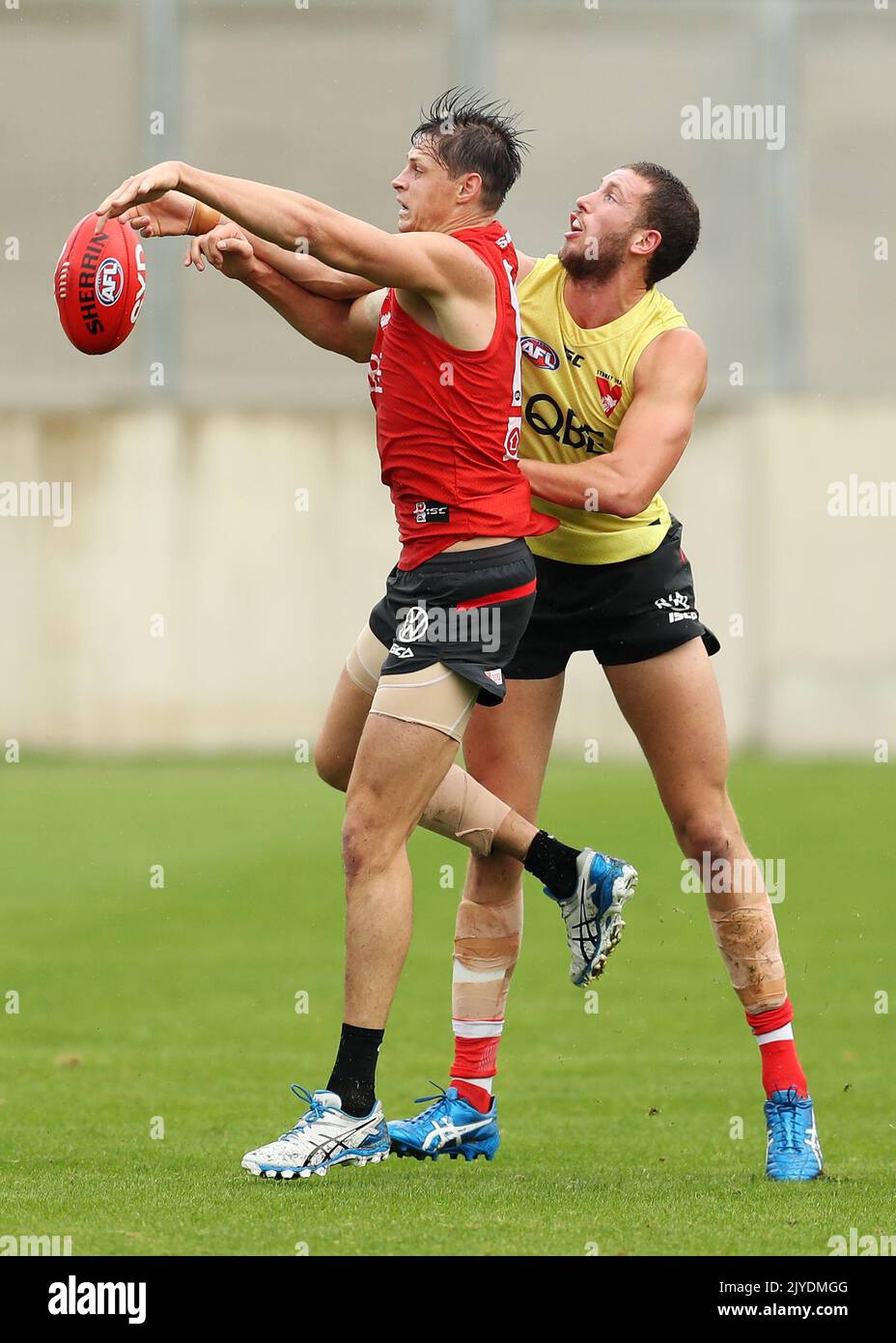 Callum Sinclair of the Swans competes with team mate Michael Knoll ...