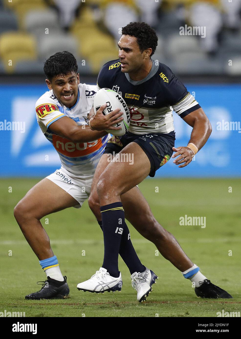 Titans player tyrone Peachey tackles Justin O’Neill of the Cowboys ...
