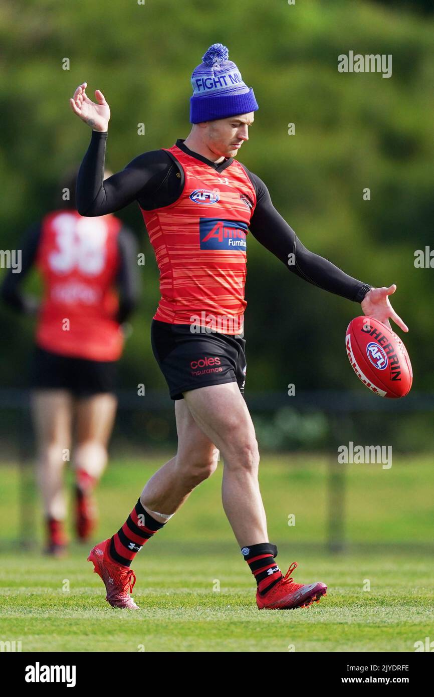 Devon Smith of Essendon kicks the ball during an Essendon Bombers AFL ...