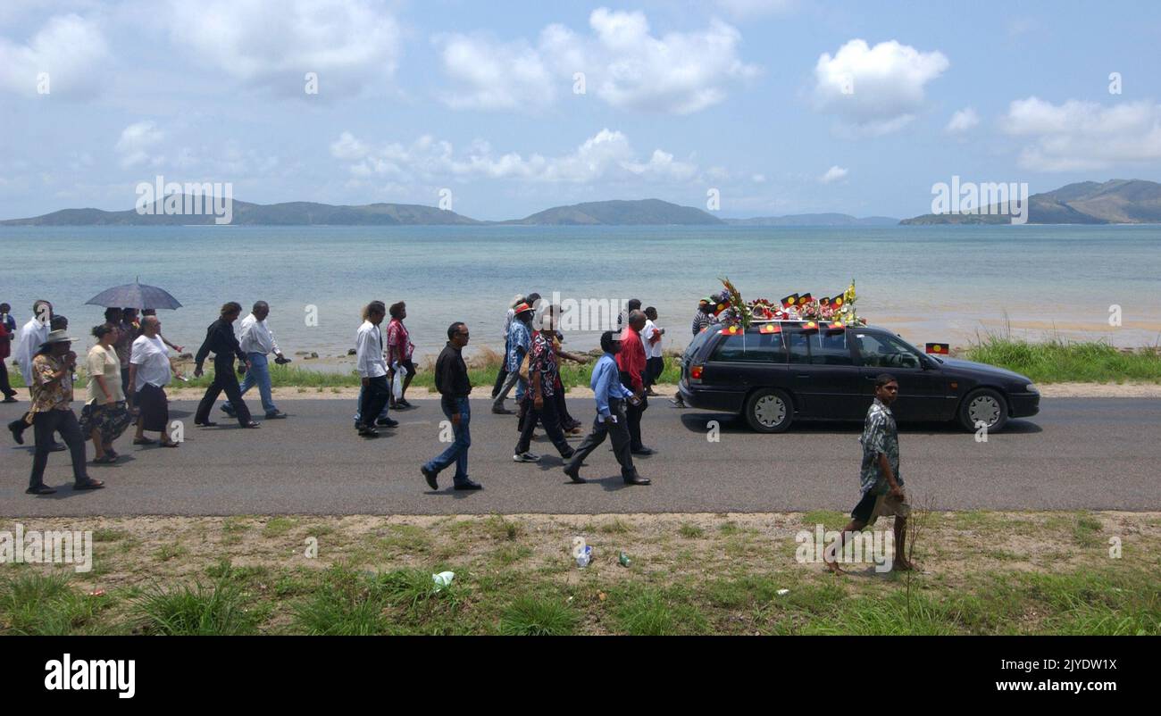 Palm Island, December 11, 2004. Palm Islanders walk with the hearse ...