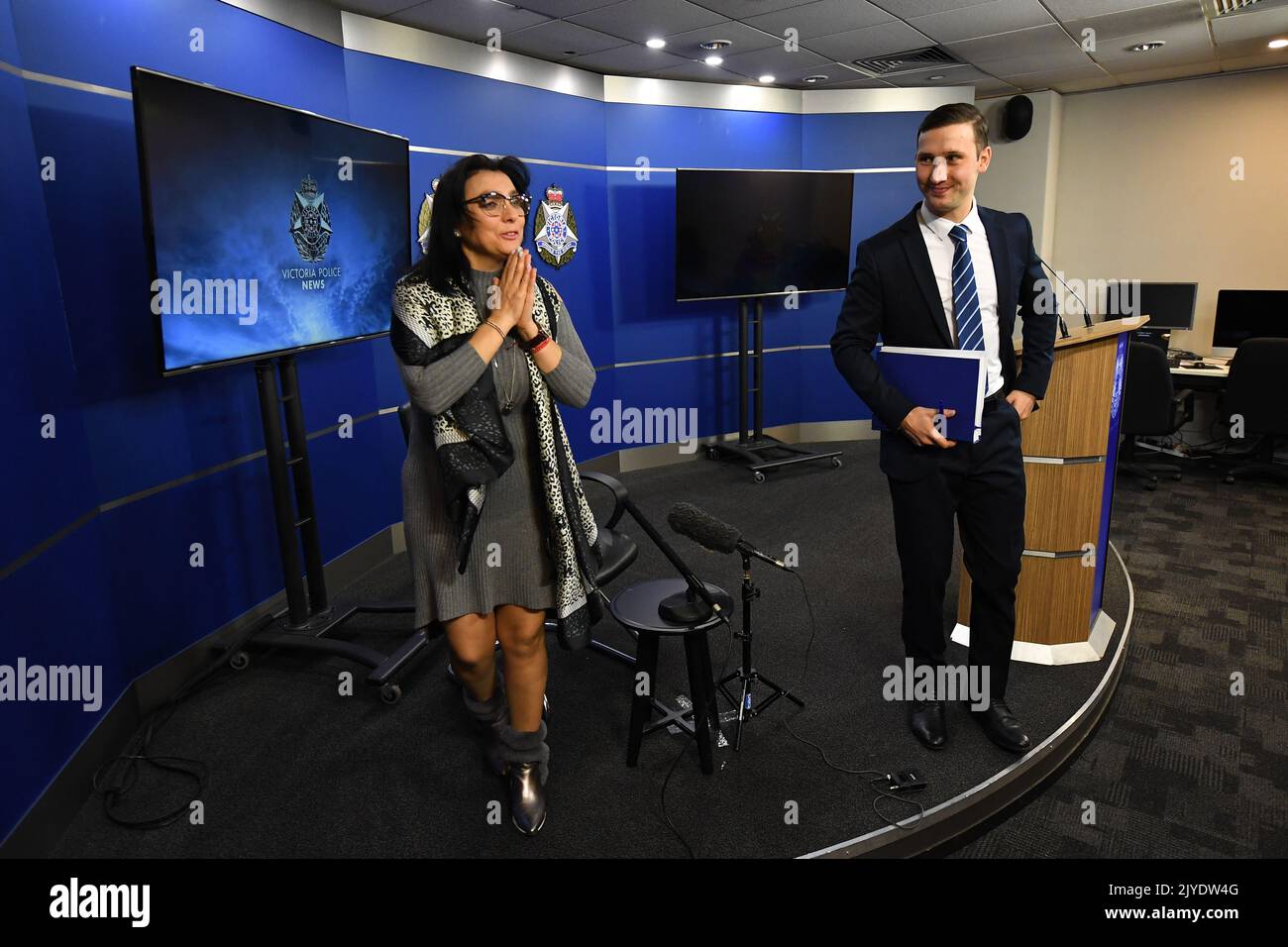 Victim Igna (left) departs a press conference in Melbourne, Thursday ...