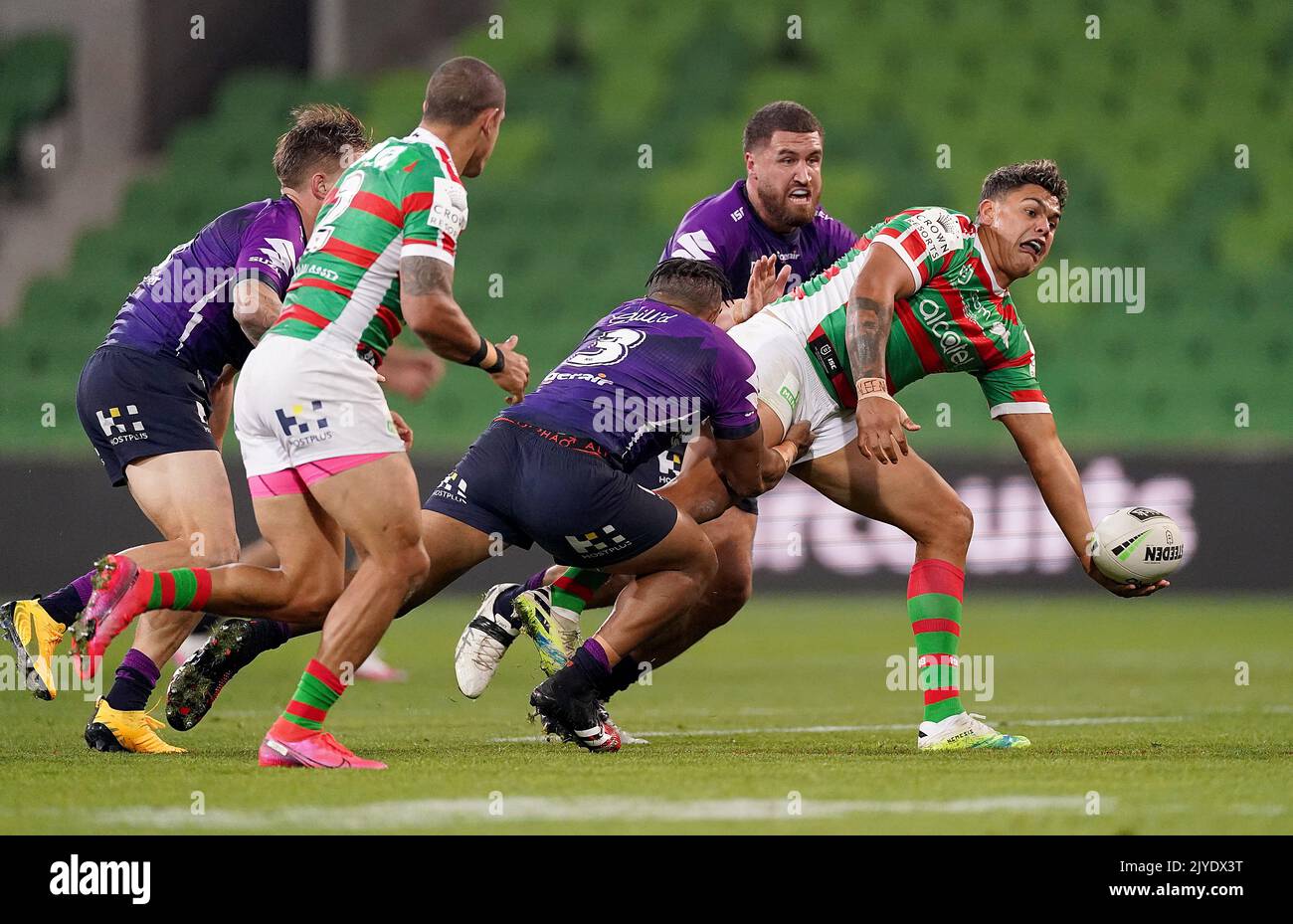Latrell Mitchell of the Rabbitohs looks to get a pass away during the ...