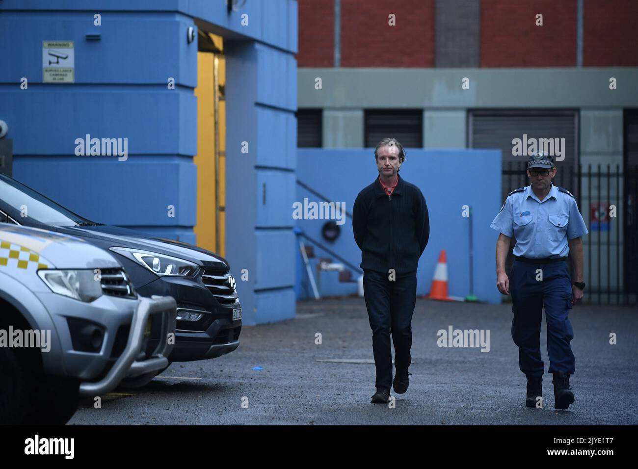 Jonathan Peter Doig (left) leaves Sutherland Police Station in Sydney ...