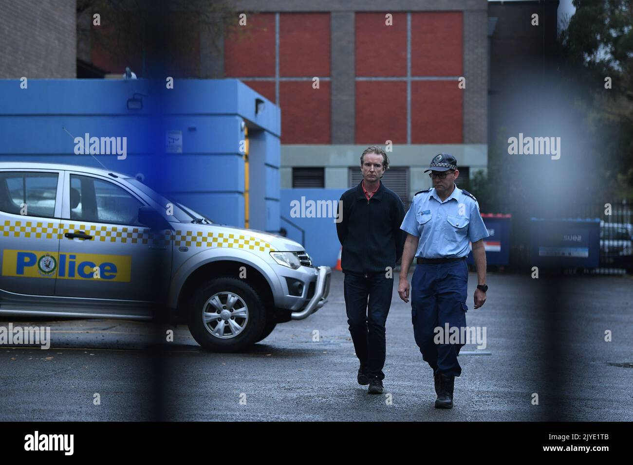Jonathan Peter Doig (left) leaves Sutherland Police Station in Sydney ...
