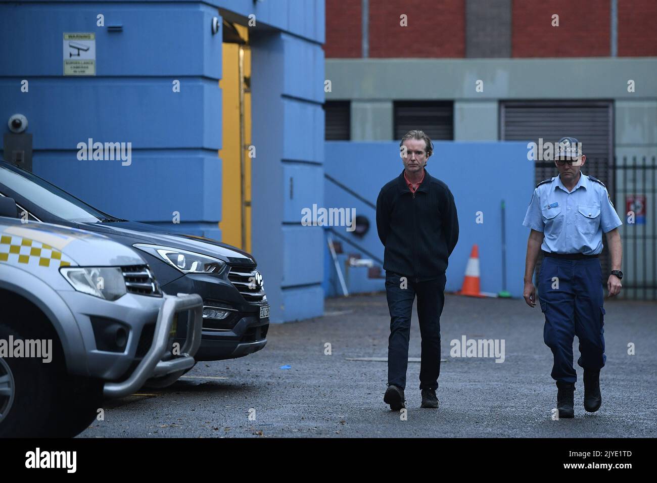 Jonathan Peter Doig (left) leaves Sutherland Police Station in Sydney ...