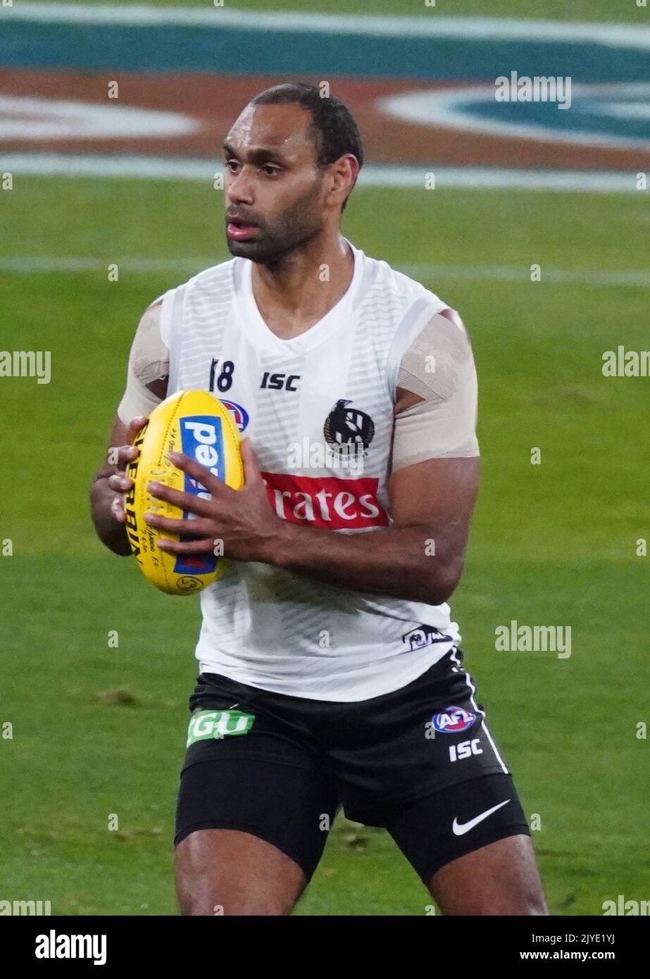 Travis Varcoe of the Magpies runs with the ball during an AFL reserves ...
