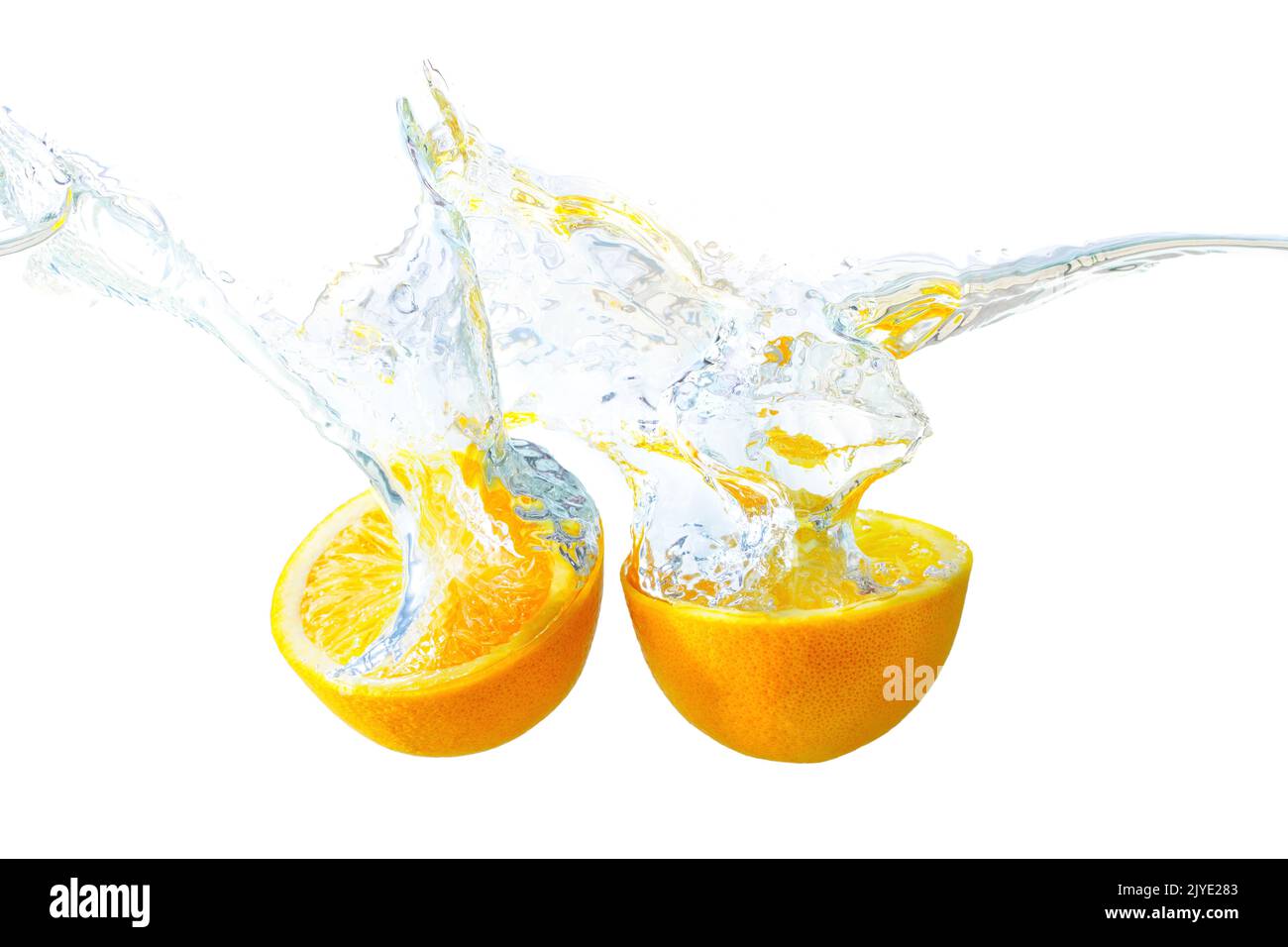 Fresh halved oranges splashing underwater isolated on white background ...