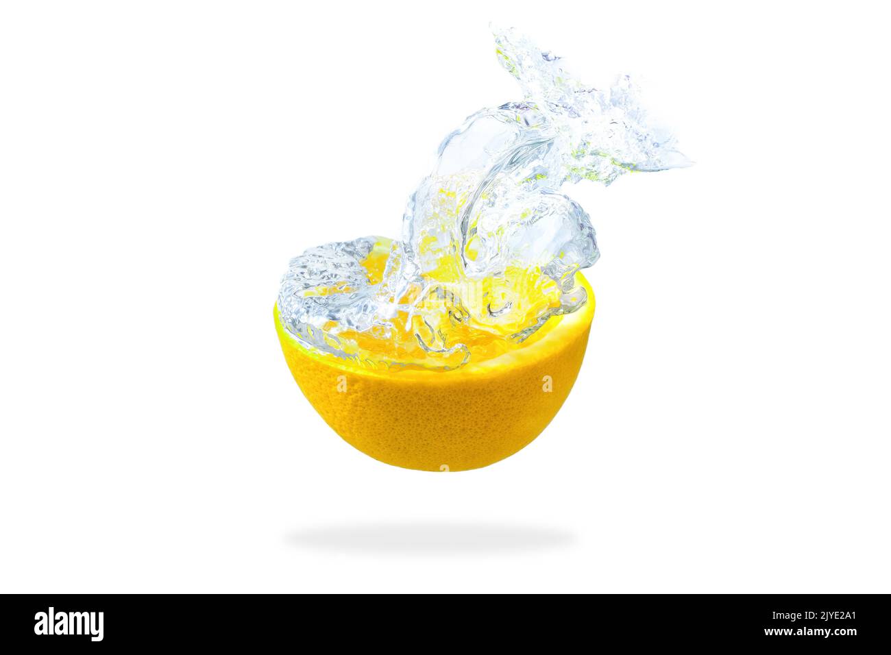 Halved lemon dropped in water isolated on white background Stock Photo - Alamy