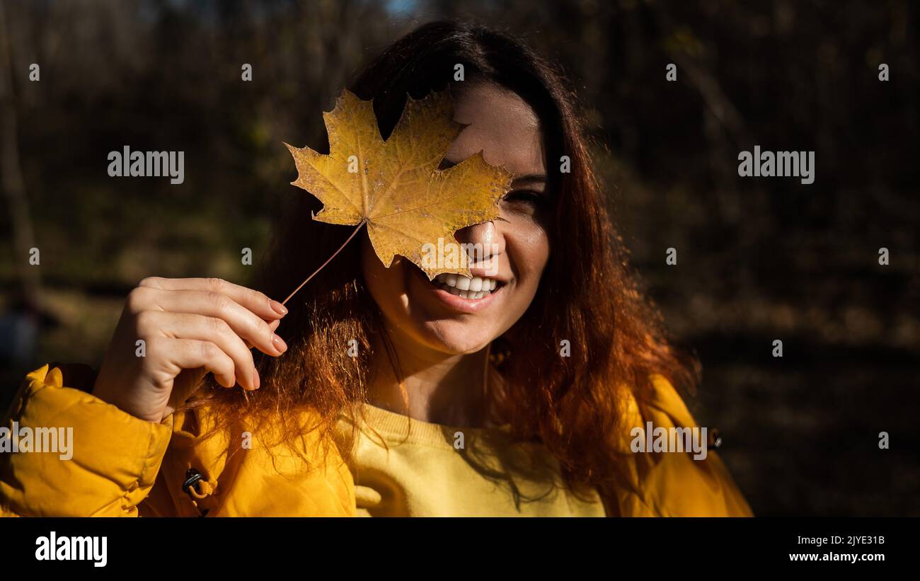 Red haired girl maple hi-res stock photography and images - Alamy